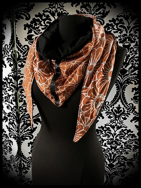 Rust scarf with floral print and black lining
